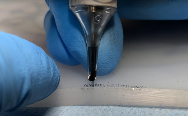 How Deep Does a Tattoo Needle Go? - TattooProfy